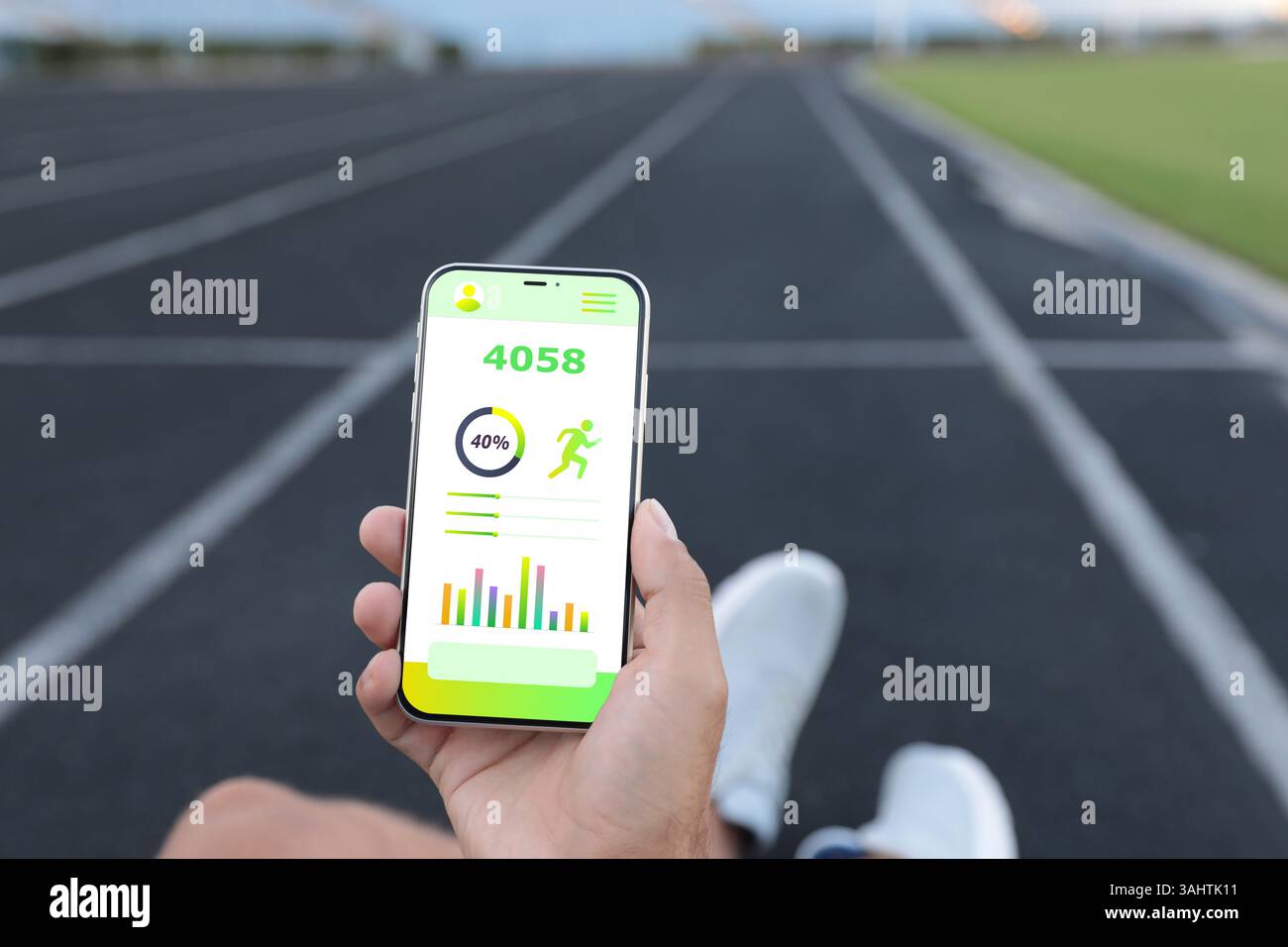 Man Using Step Counting App On Smartphone At Stadium Closeup Stock