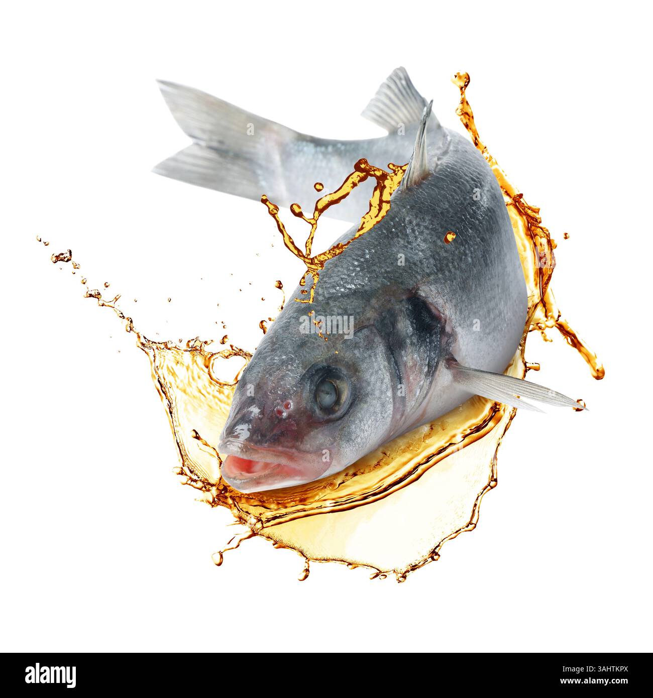 Fresh fish in oil splash on white background Stock Photo - Alamy