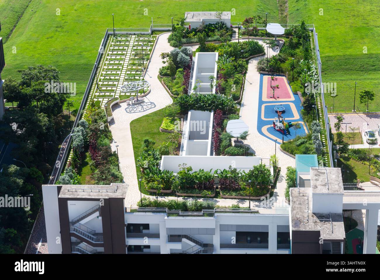 Aerial view. Trees plants planted on building structure carpark rooftop ...