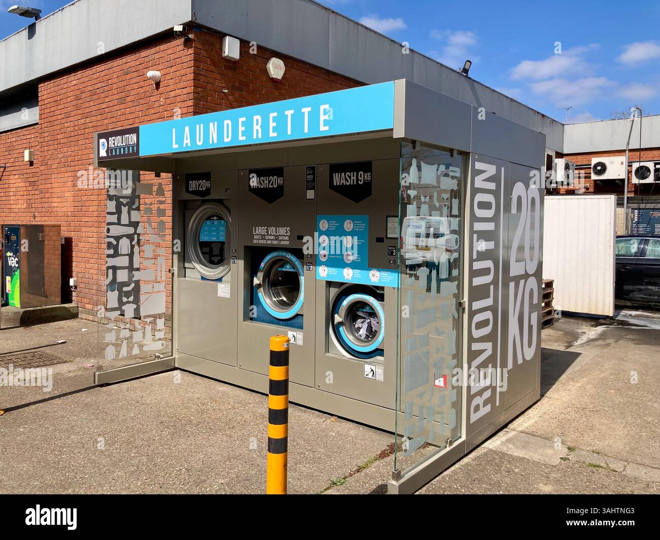 A Wash.ME Revolution Laundry self-service launderette at petrol station, Orpington, Kent, UK ...