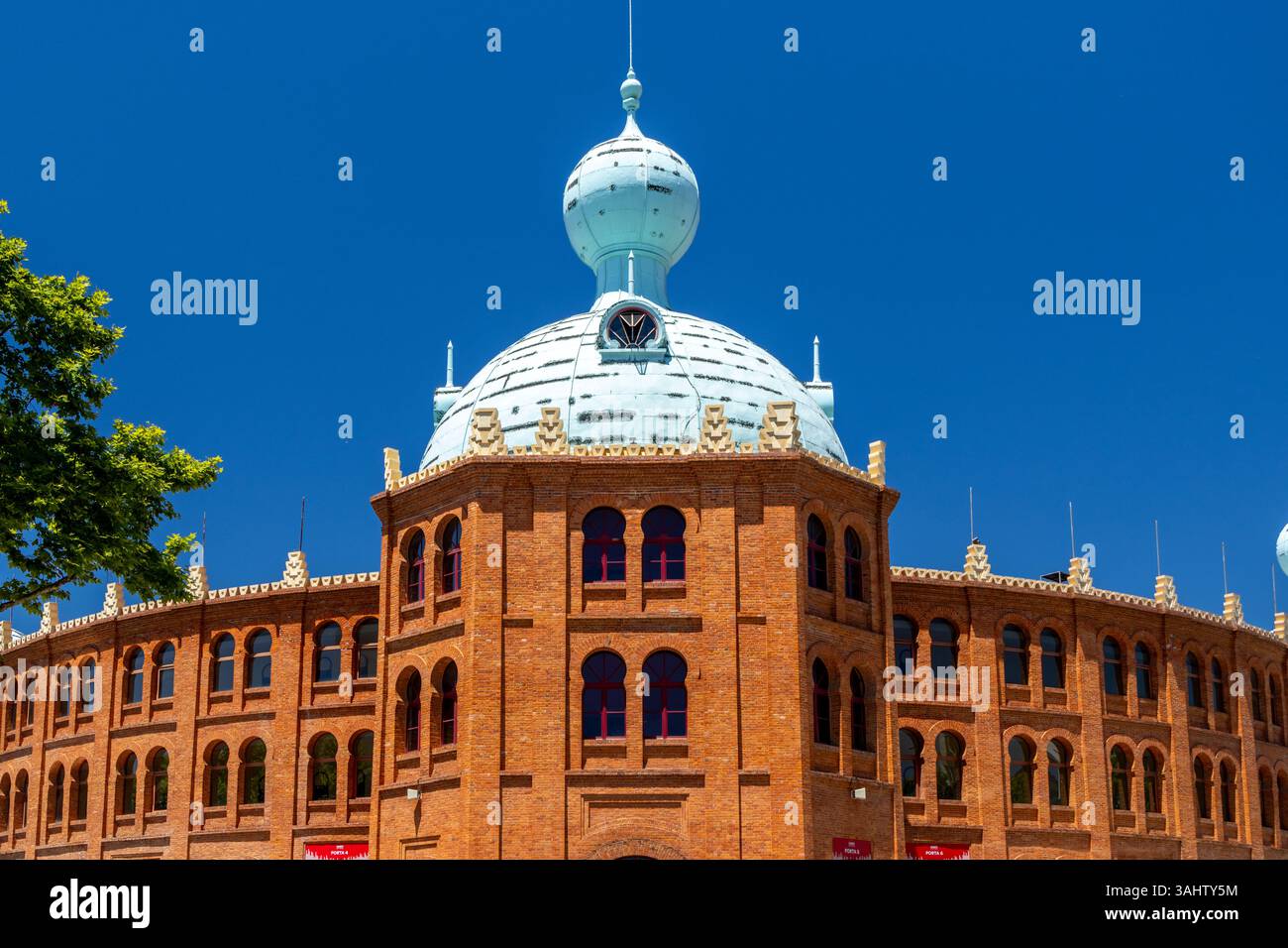 Campo pequeno bullring with its distinctive dome and red brick facade ...