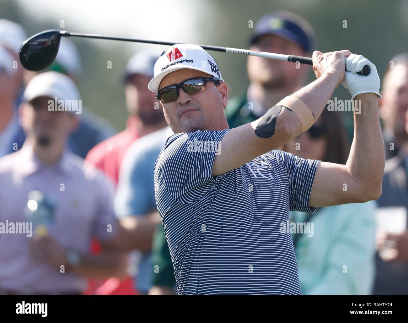 Augusta, United States. 10th Apr, 2025. Zach Johnson hits his tee shot ...