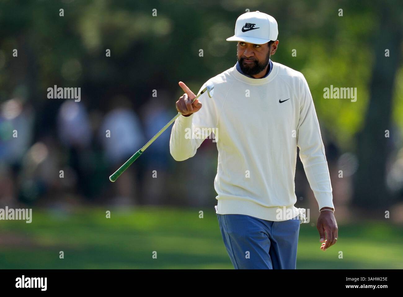 Tony Finau points to the gallery on the first hole during the first ...