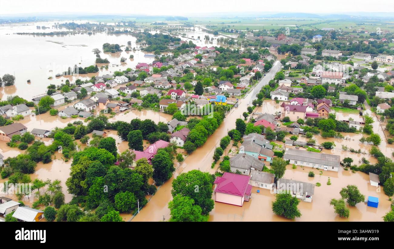 Aerial view of flooded residential area. Wide aerial view of a town submerged in floodwater ...