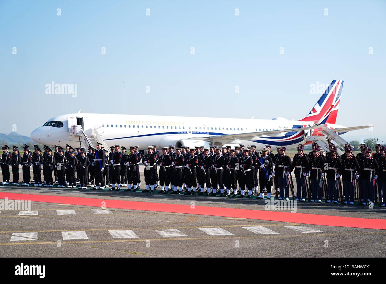 A guard of honour wait for King Charles III and Queen Camilla to depart ...