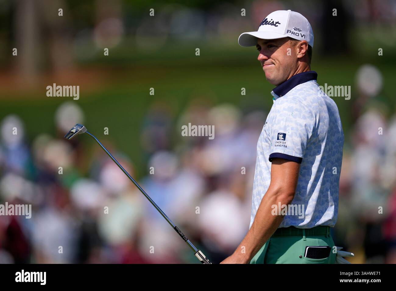 Justin Hastings, of Cayman Islands, reacts after missing a putt on the ...