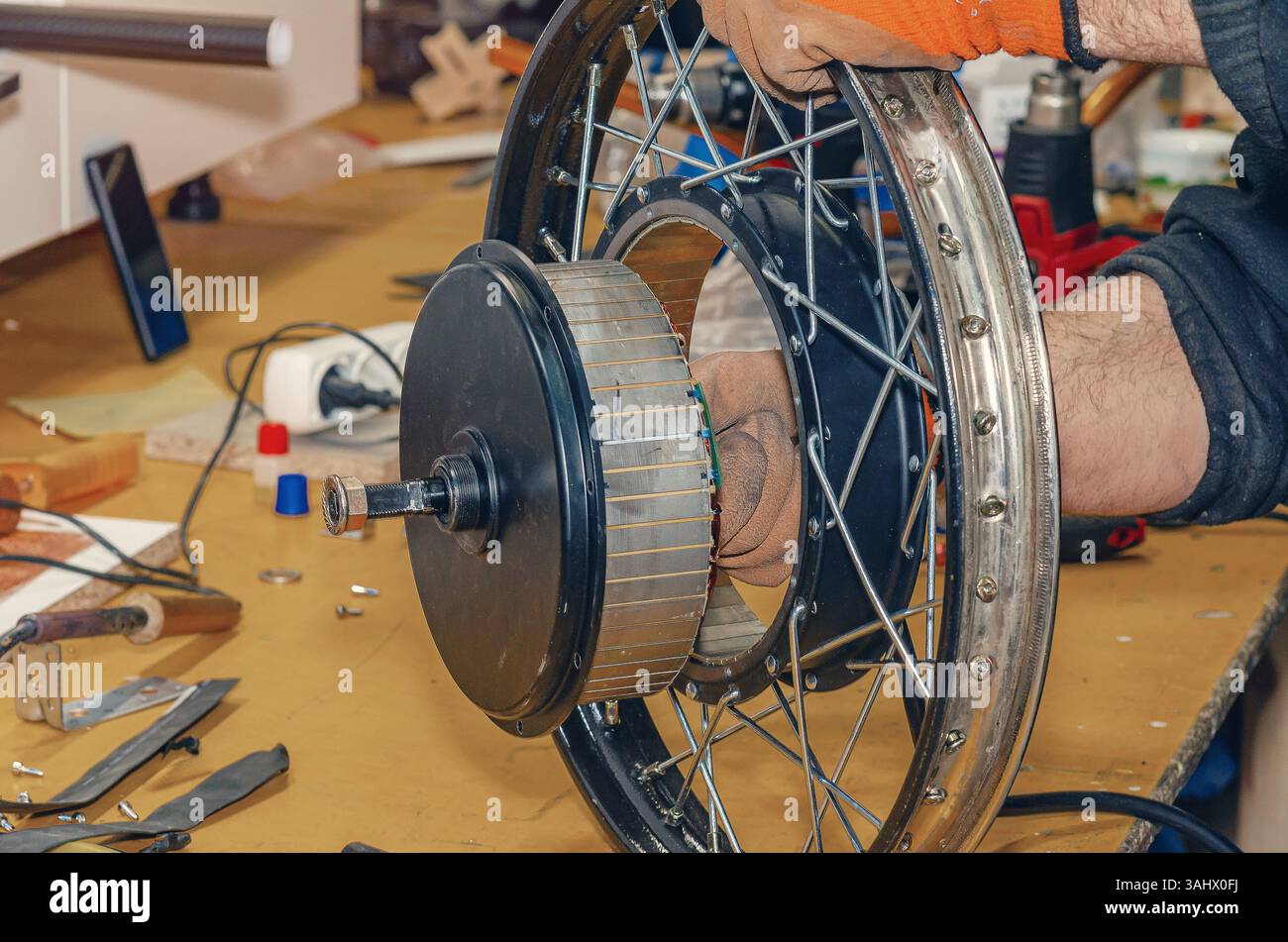 Disassembling wheel of electric bicycle close-up. Repair electric motor ...