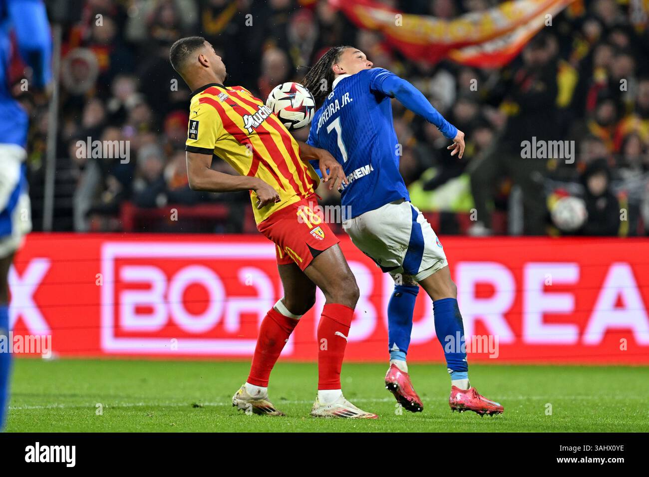 Lens, France. 16th Feb, 2025. Andy Diouf (18) of Lens and Diego Moreira ...