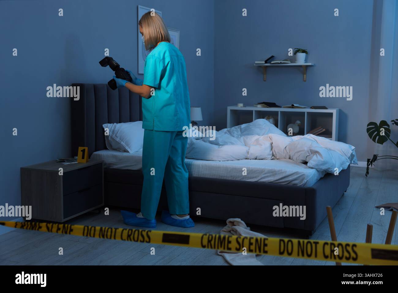 Forensic expert with camera working at crime scene indoors Stock Photo ...