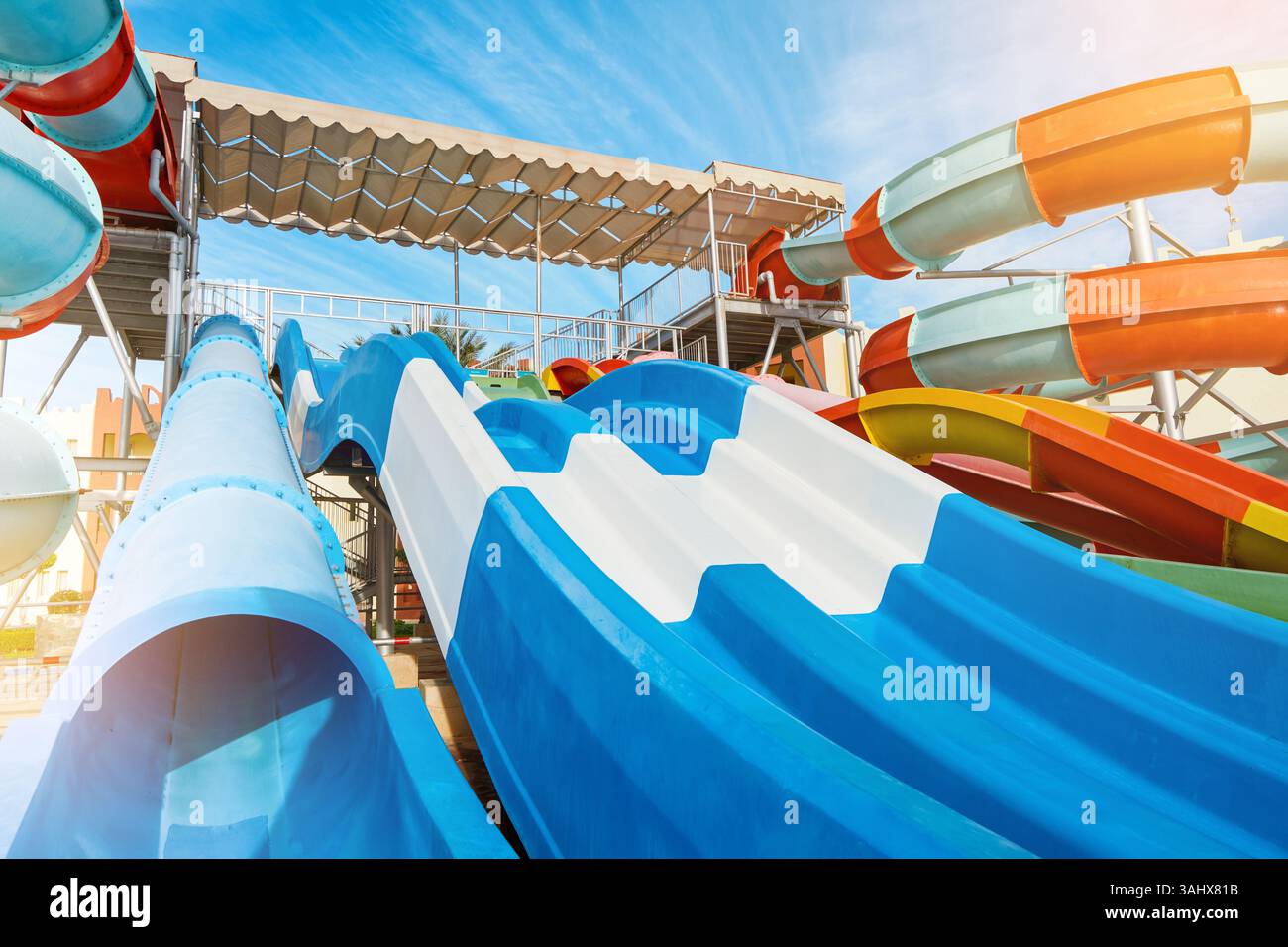 Water park with water colored flights, slides, splashes and pools at ...