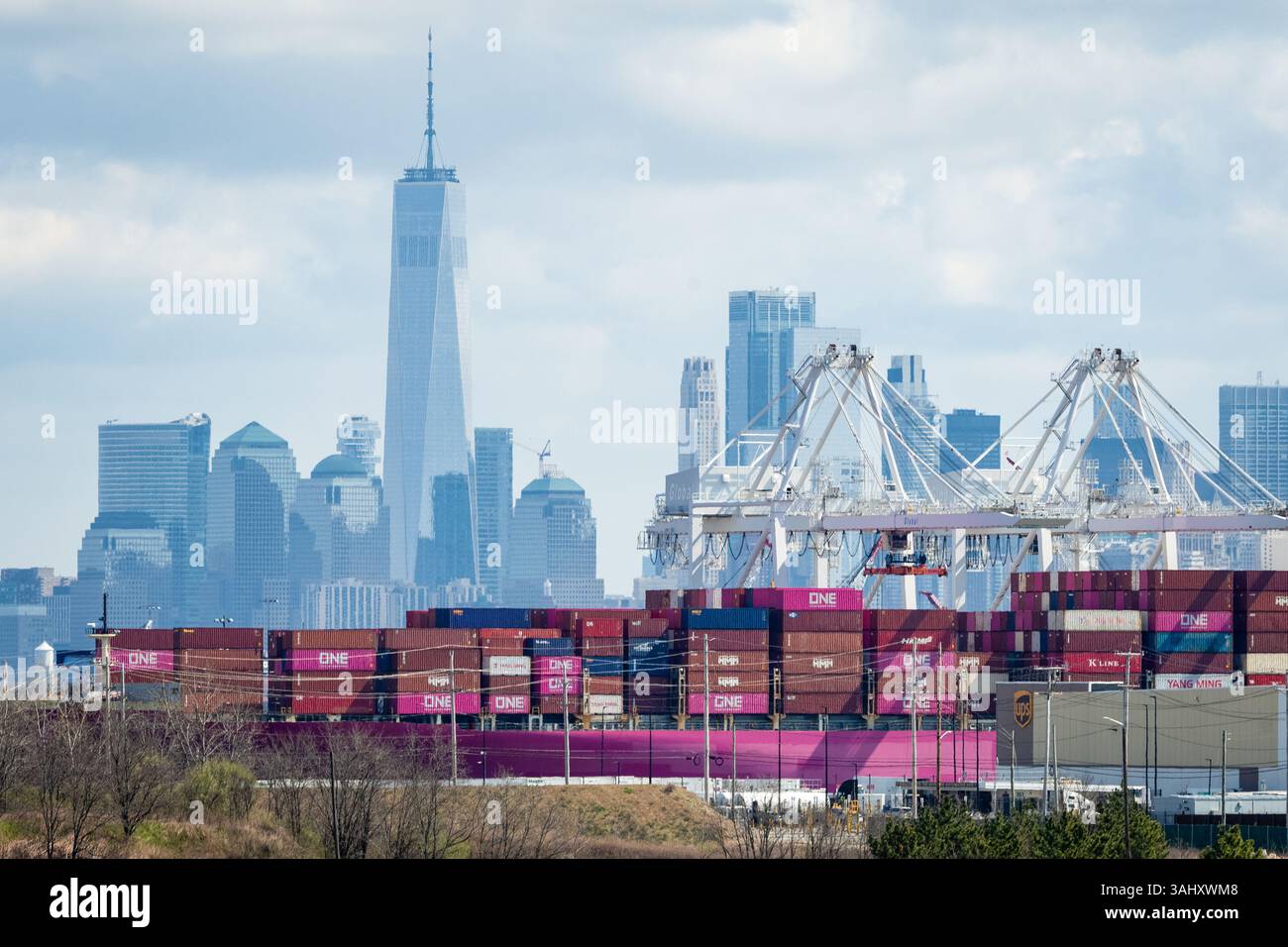 With the New York Manhattan skyline in the background, cargo shipping ...