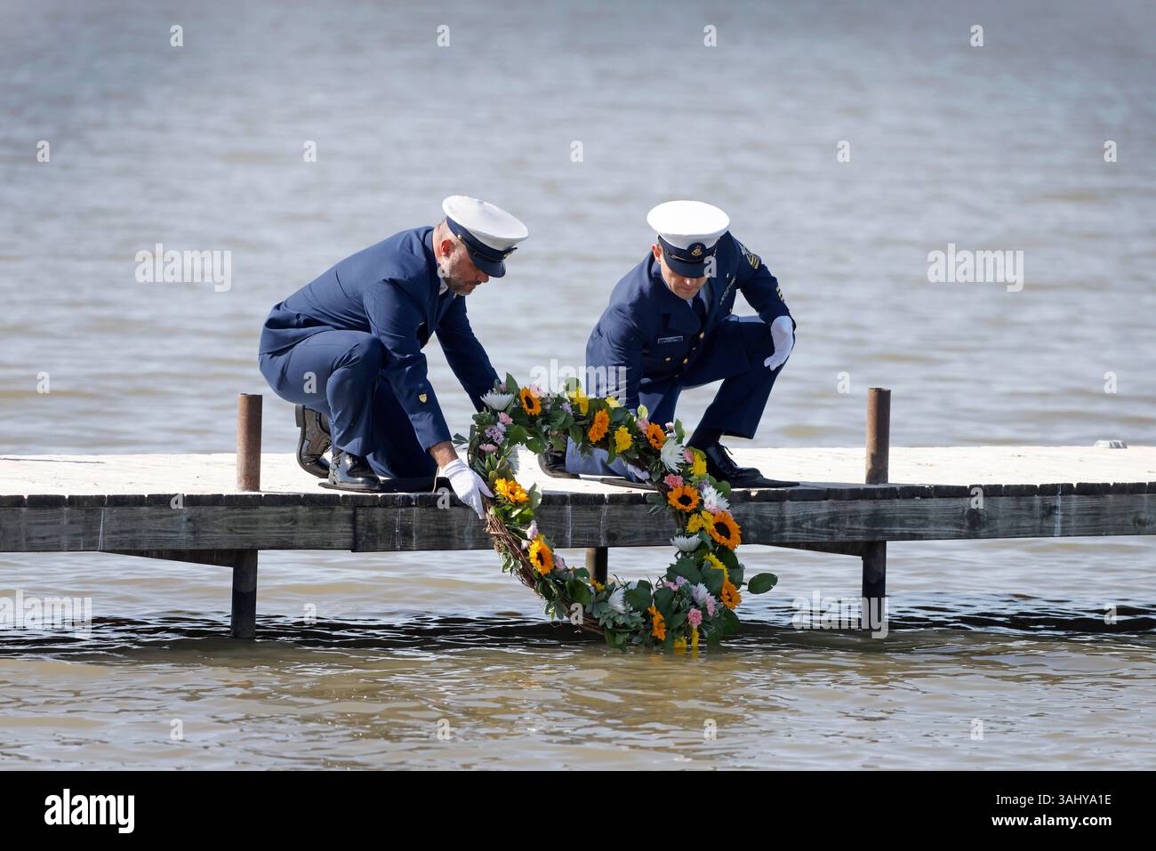 IMAGE DISTRIBUTED FOR IMAGINE - Coast Guard Chief Justin Lane, left ...