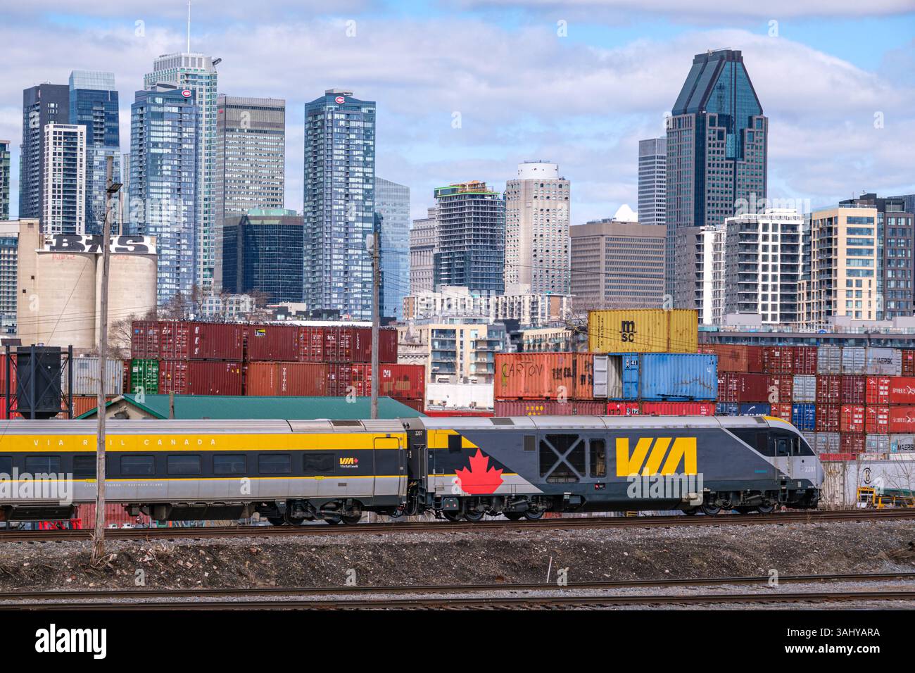 Montreal, Canada - April 4, 2025: A VIA Rail train passes by colorful ...