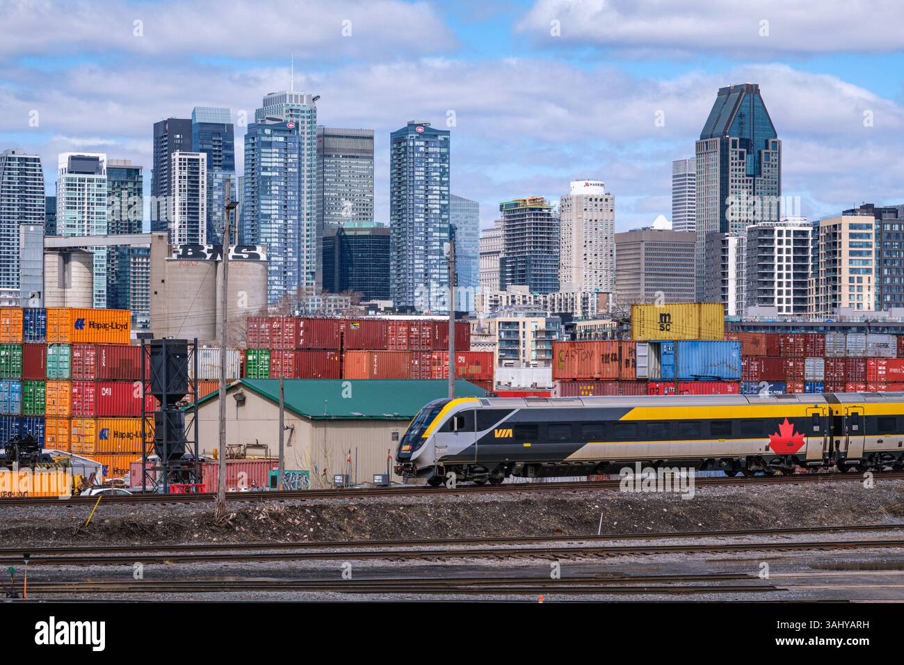 Montreal, Canada - April 4, 2025: A VIA Rail train passes by colorful ...