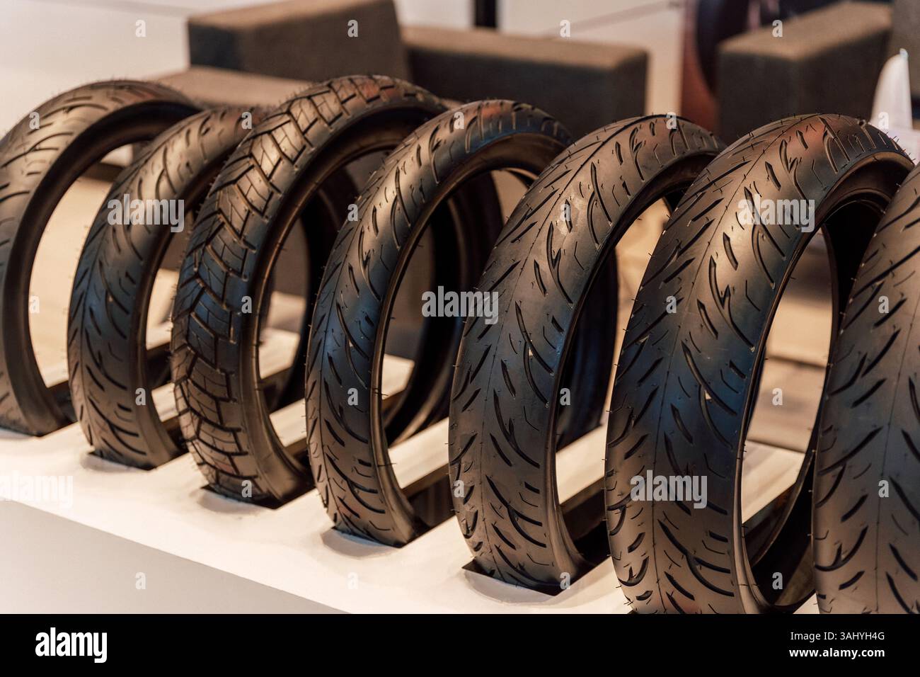 Motorcycle racing tire display in store. Black rubber tires for ...