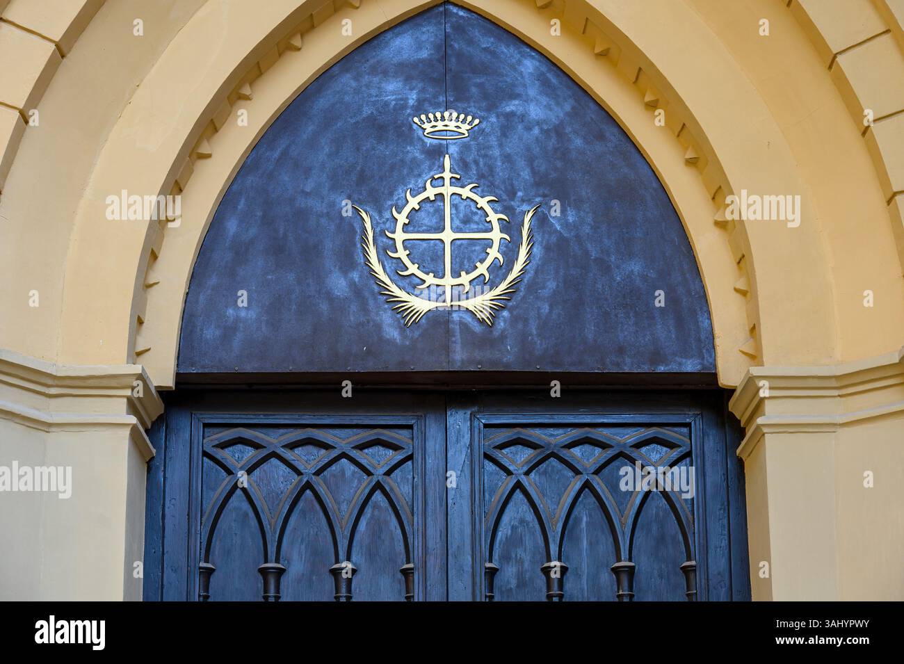 Gold-colored symbol on the entrance door of the Parish of Santa ...
