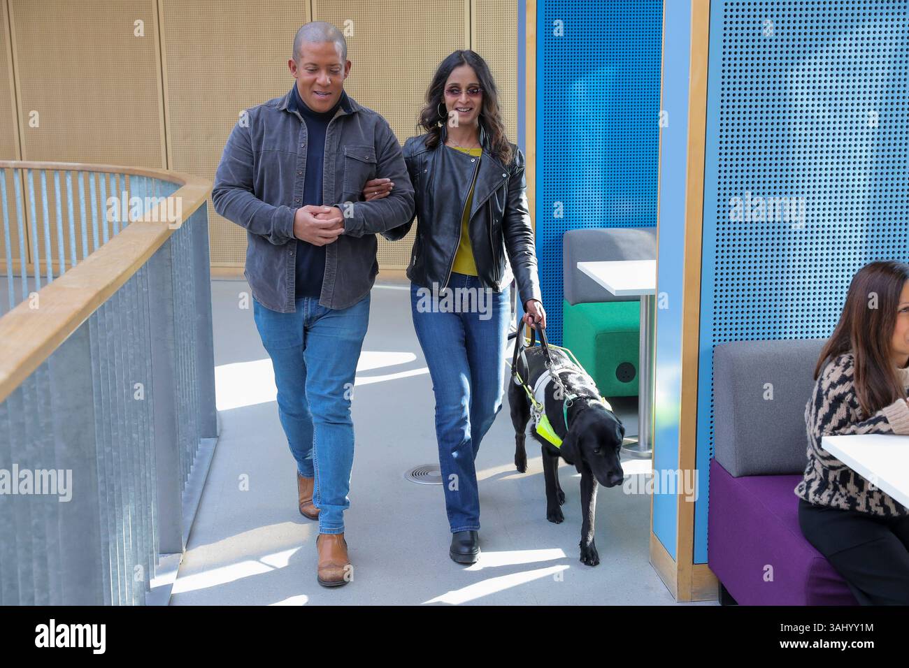 Man guiding visually impaired friend Stock Photo - Alamy