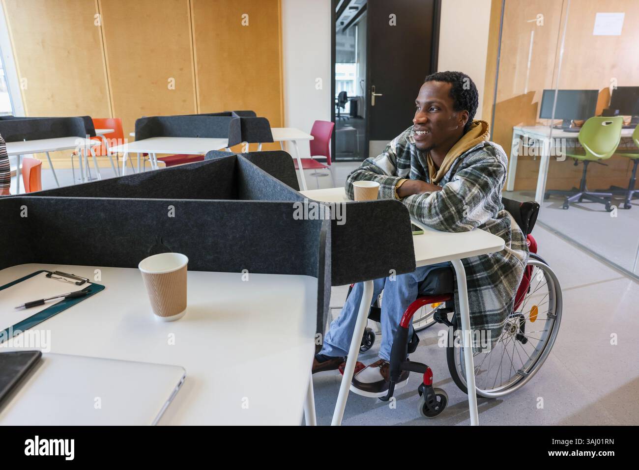 Smiling man disability wheelchair hi-res stock photography and images ...