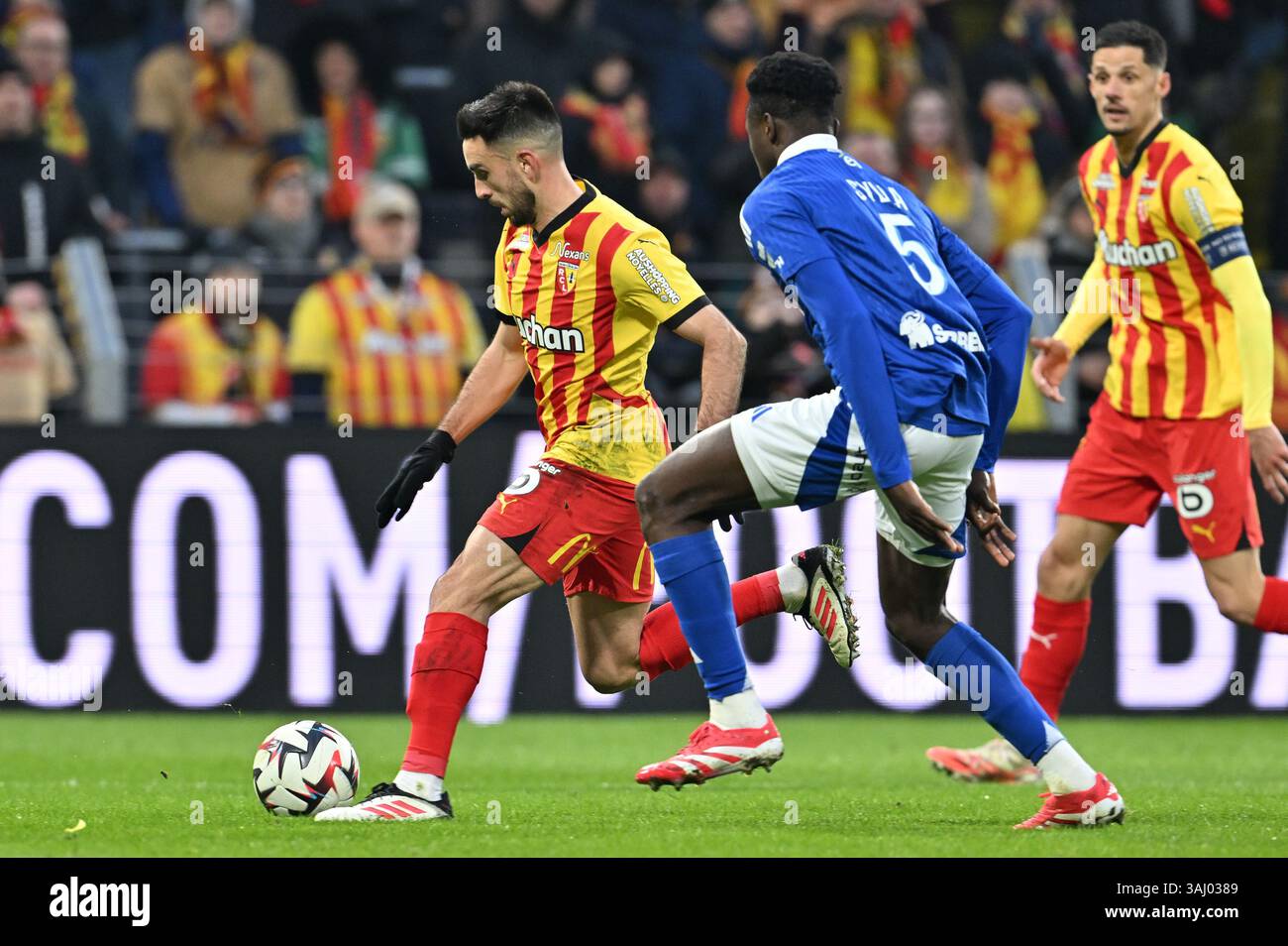 Adrien Thomasson (28) of Lens and Abakar Sylla (5) of Strasbourg during ...