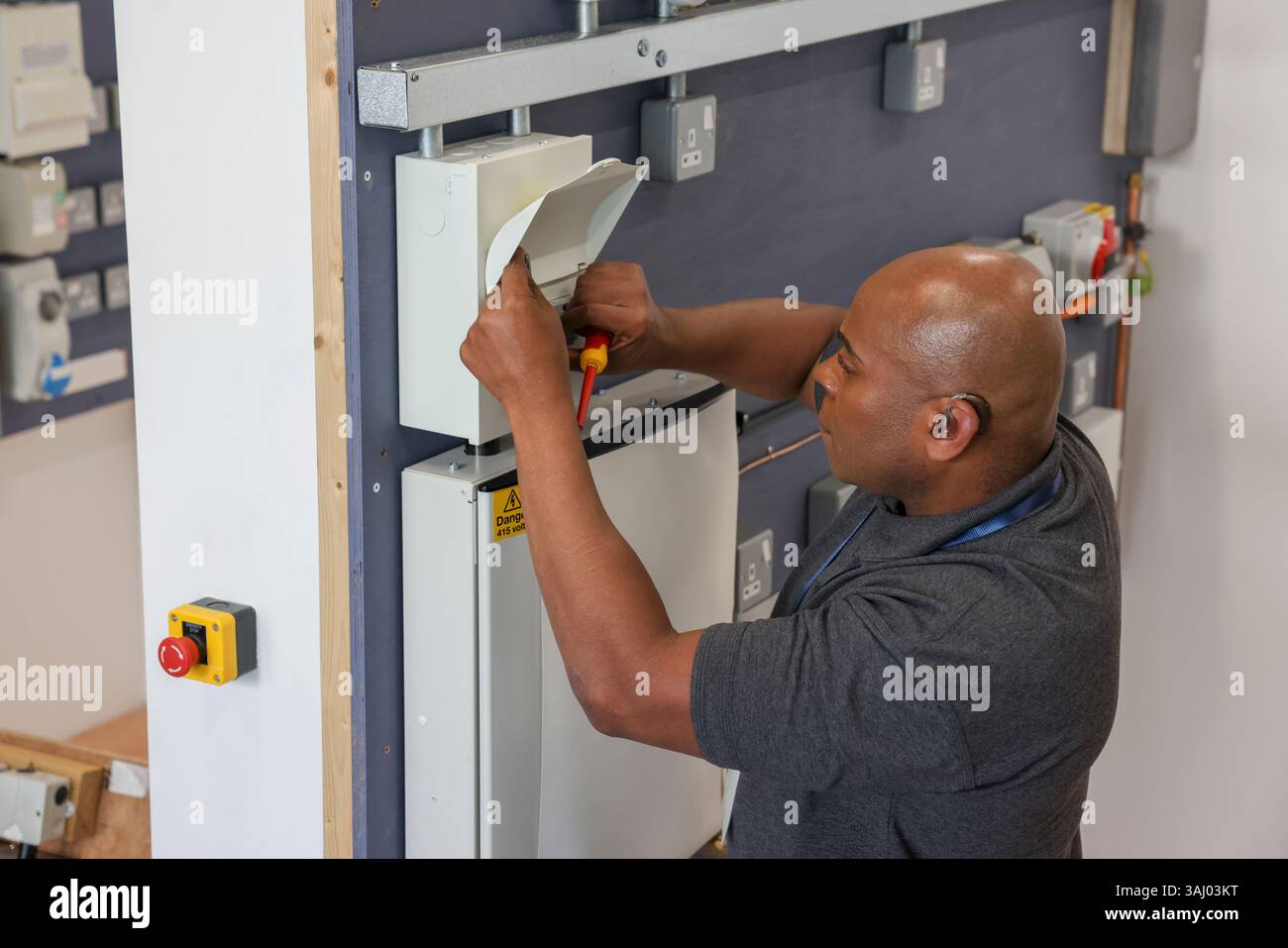 Disabled man working in workshop Stock Photo - Alamy