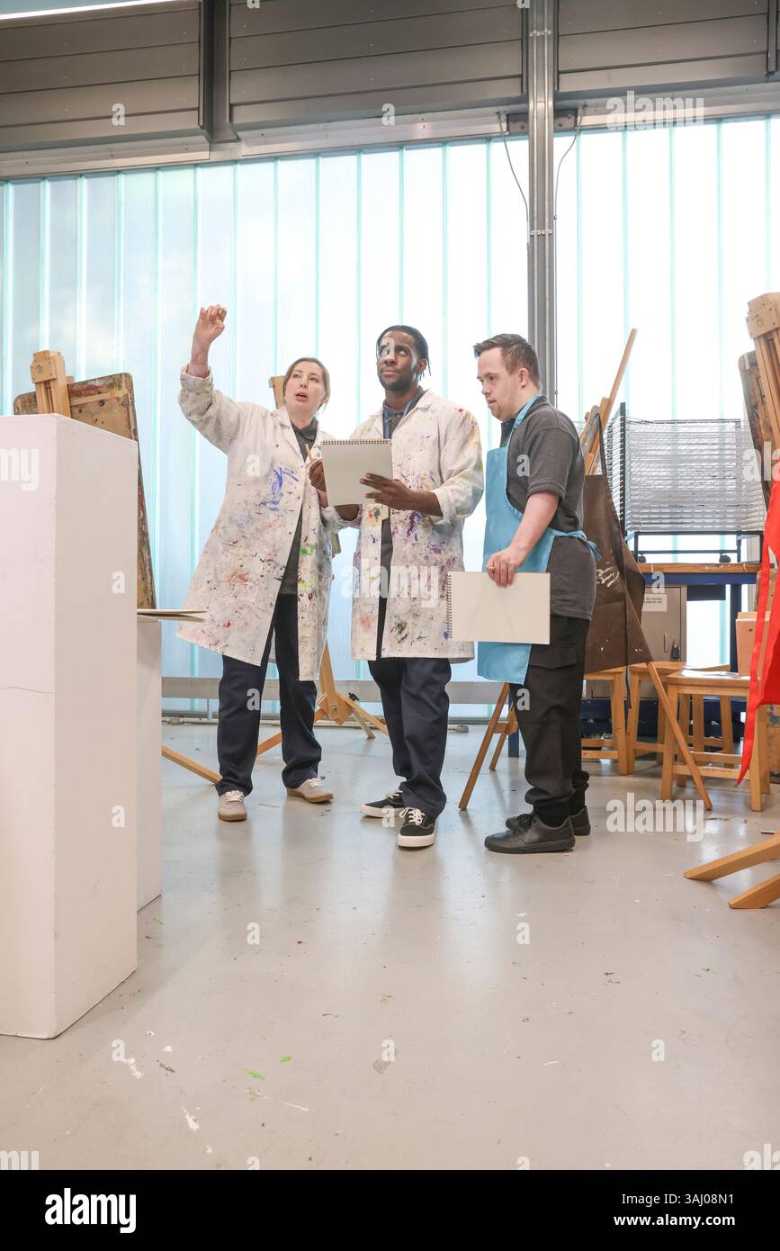 Disabled people drawing at workshop Stock Photo - Alamy