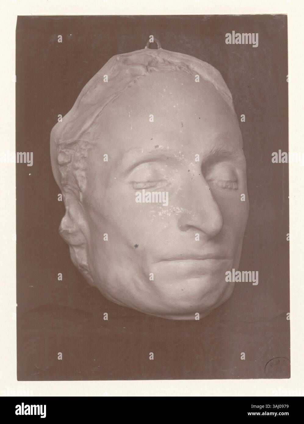 This photomechanical print depicts the death mask of Blaise Pascal, the ...