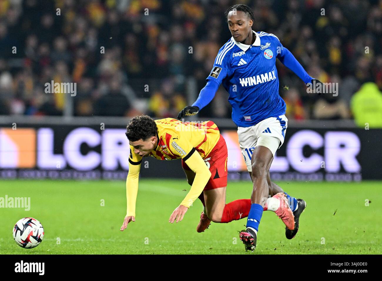 Neil El Aynaoui (23) of Lens and Emanuel Emegha (10) of Strasbourg ...
