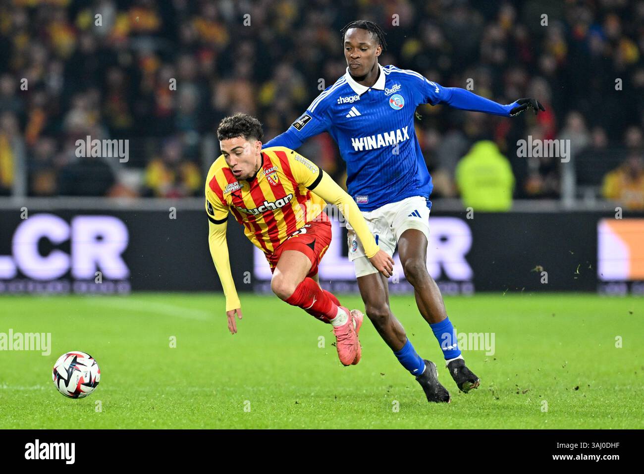 Lens, France. 16th Feb, 2025. Neil El Aynaoui (23) of Lens and Emanuel ...