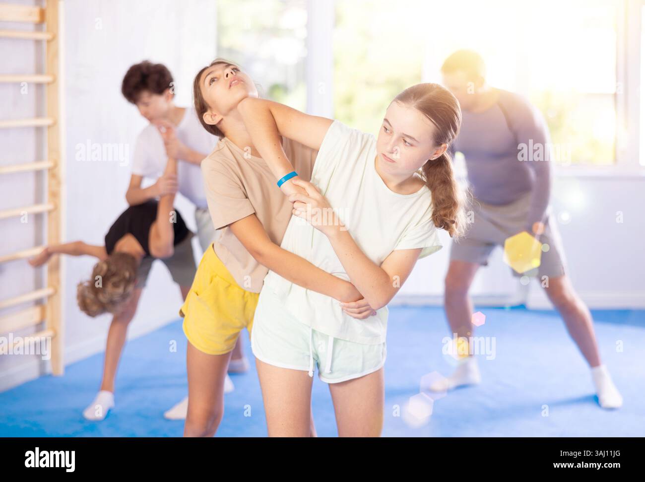 Two girls training self-defense techniques Stock Photo - Alamy
