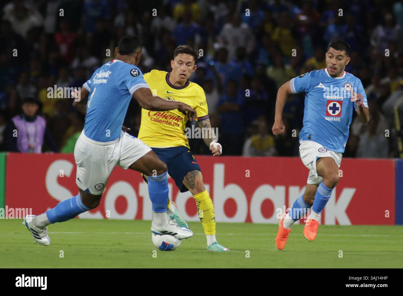 Willer Ditta #4 of Cruz Azul and Brian Rodriguez #7 of America battle ...