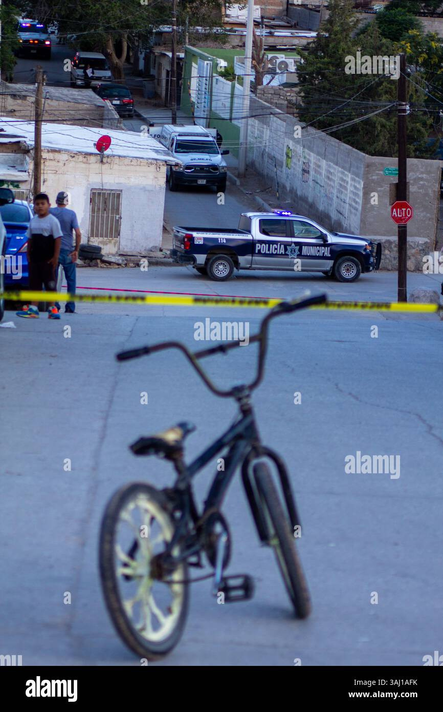 Forensic investigators and police officers examine a crime scene ...