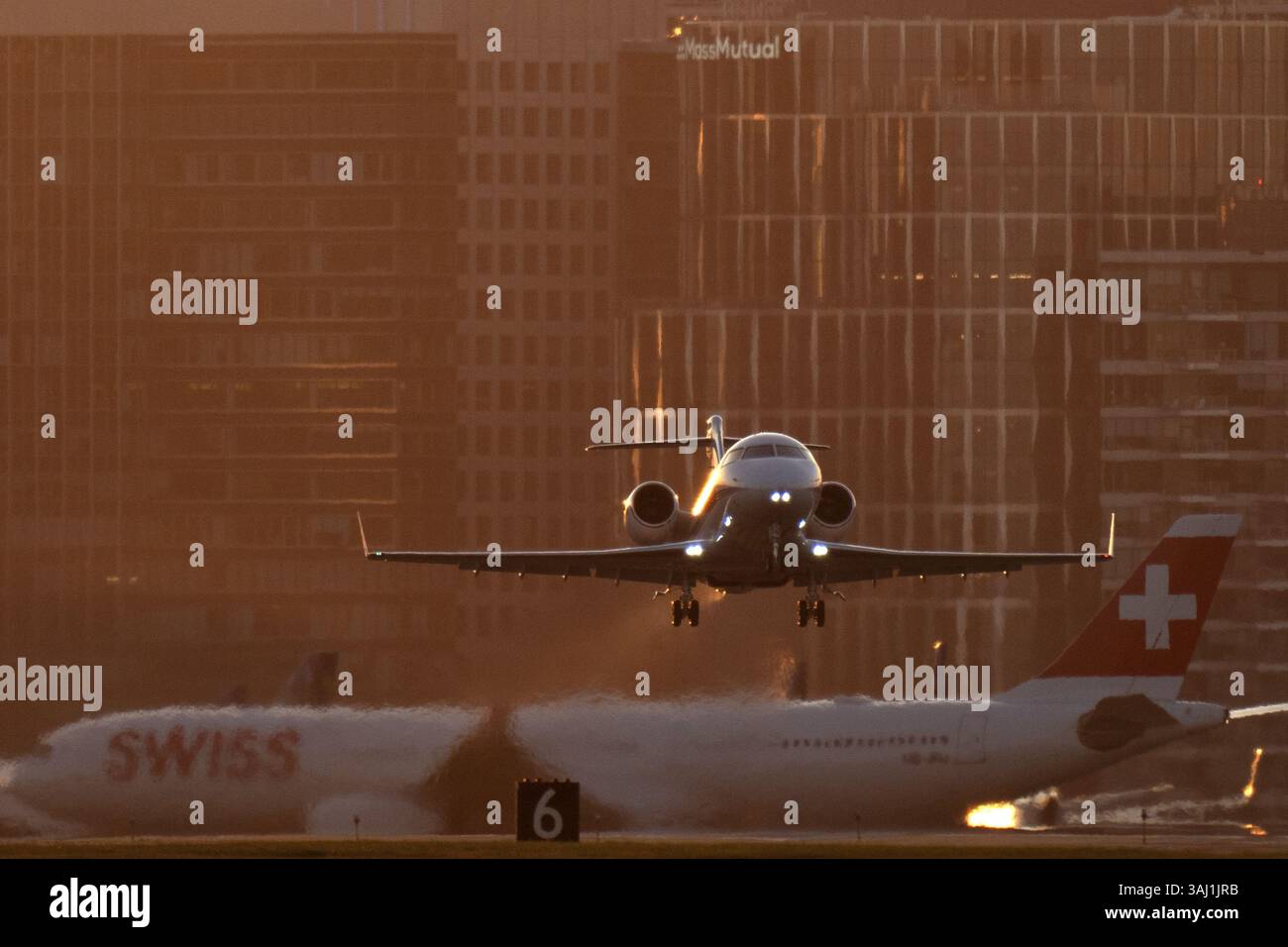 jet plane taking off from Logan International Airport city skyline ...