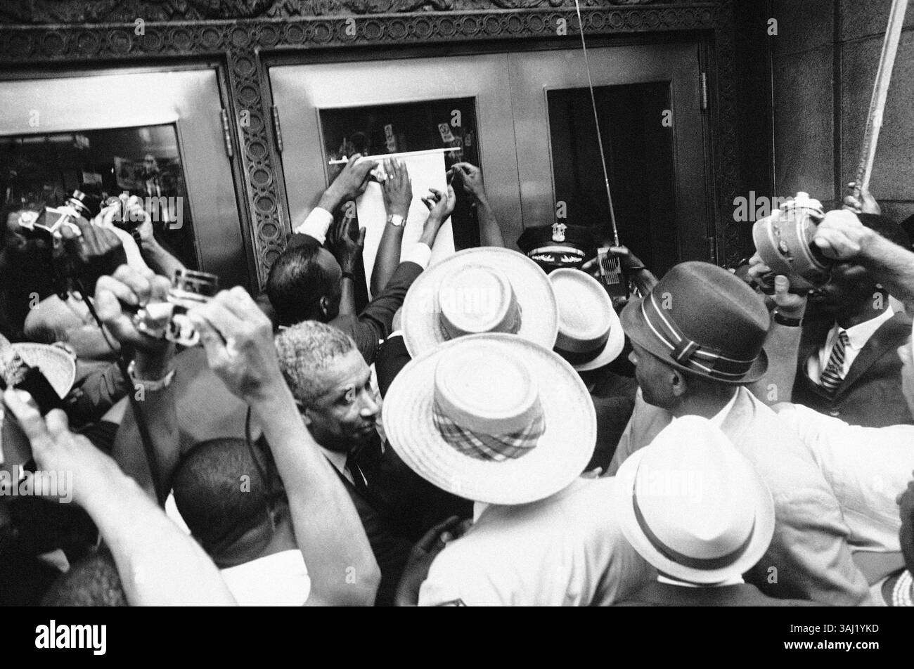 FILE - Hands of civil rights leaders Al Raby, left, and Dr. Martin ...