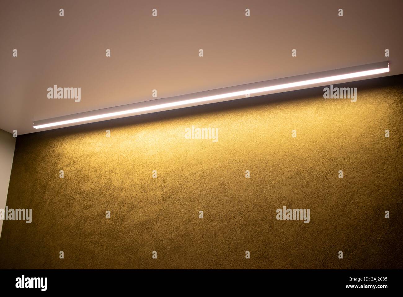 LED linear wall lighting with golden texture Stock Photo - Alamy