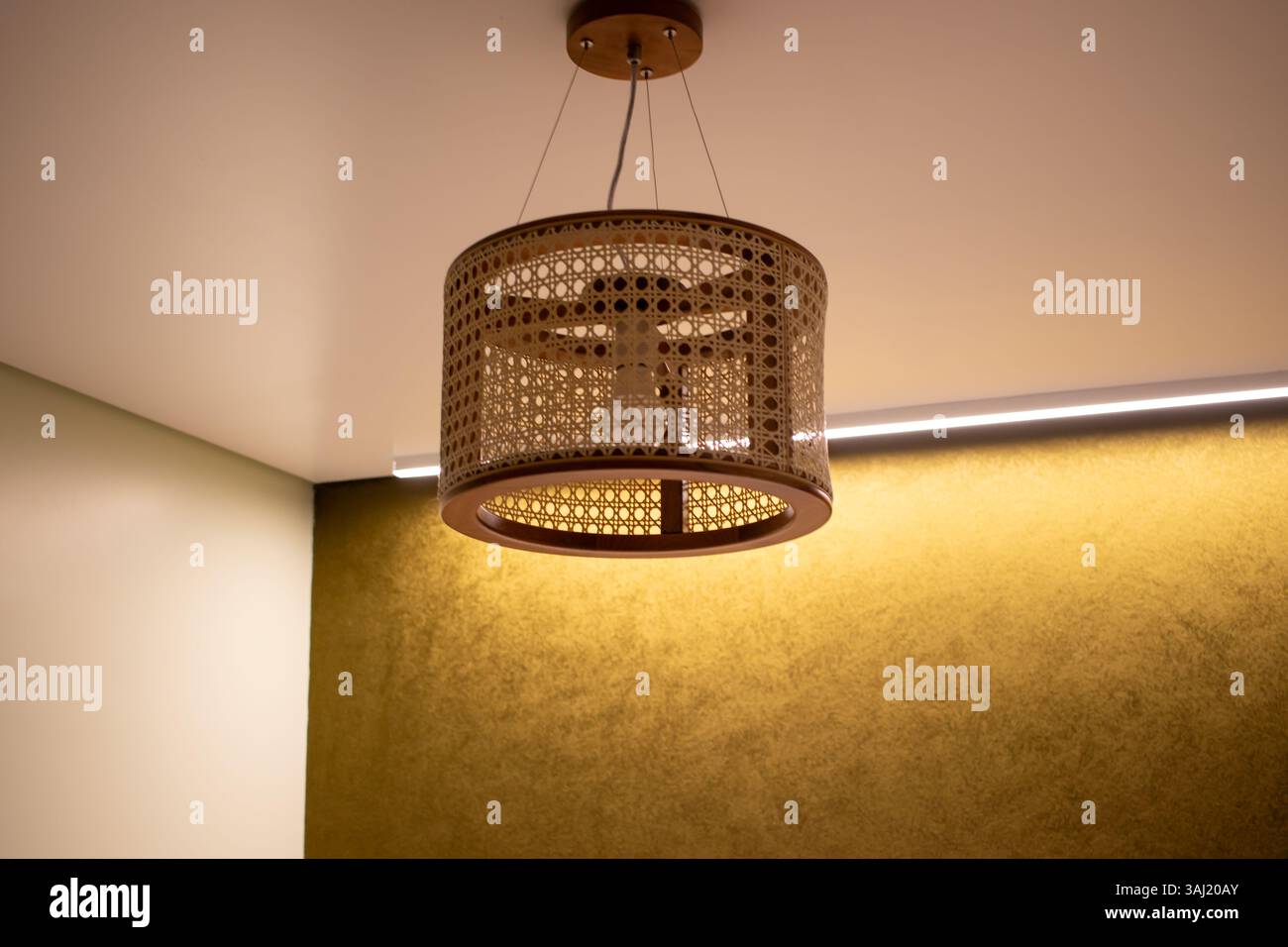 Rustic style ceiling light with natural straw in a modern interior Stock Photo - Alamy