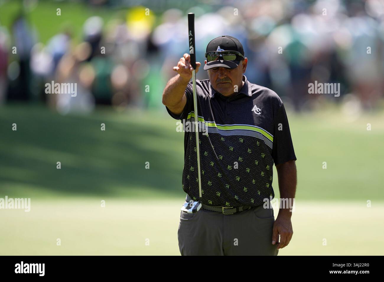 Angel Cabrera, of Argentina, lines up a putt on the sixth hole during ...