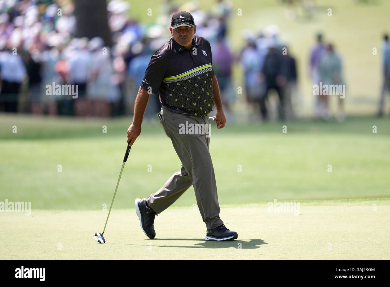 Angel Cabrera, of Argentina, lines up a putt on the sixth hole during ...