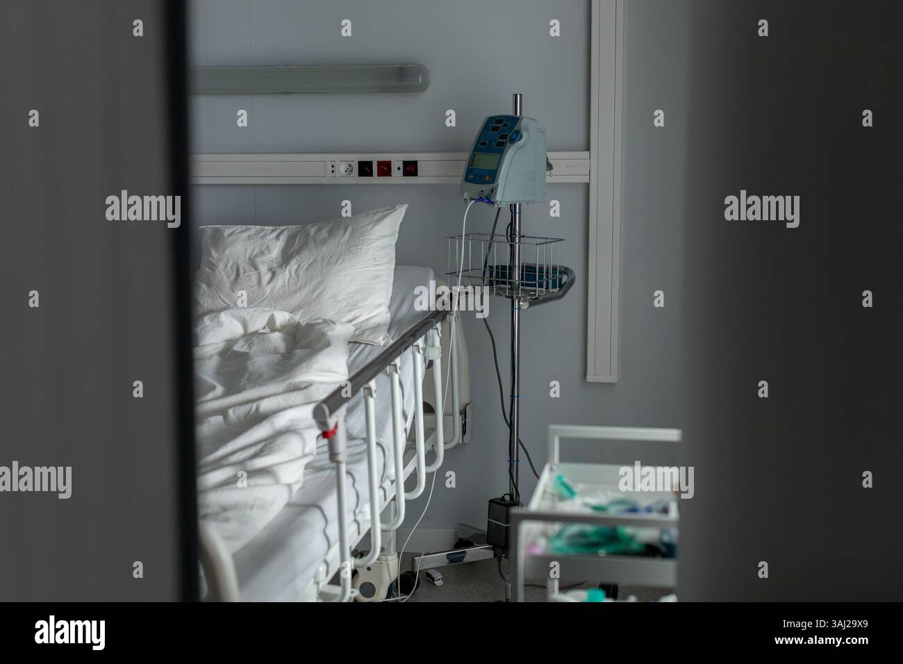 A Hospital Bed equipped with Medical Equipment in a WellOrganized ...