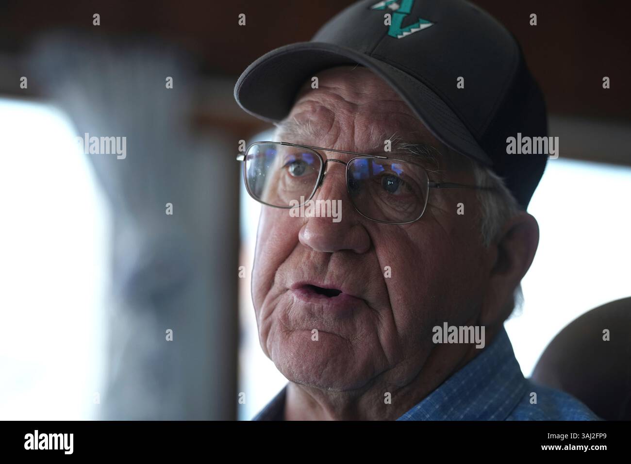 Craig Wallis, owner of W&W Dock and Ice sits in the captain's seat of ...