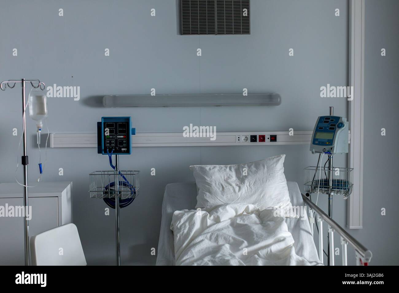 A Modern Hospital Bed equipped with essential Medical Equipment for patient care and comfort ...