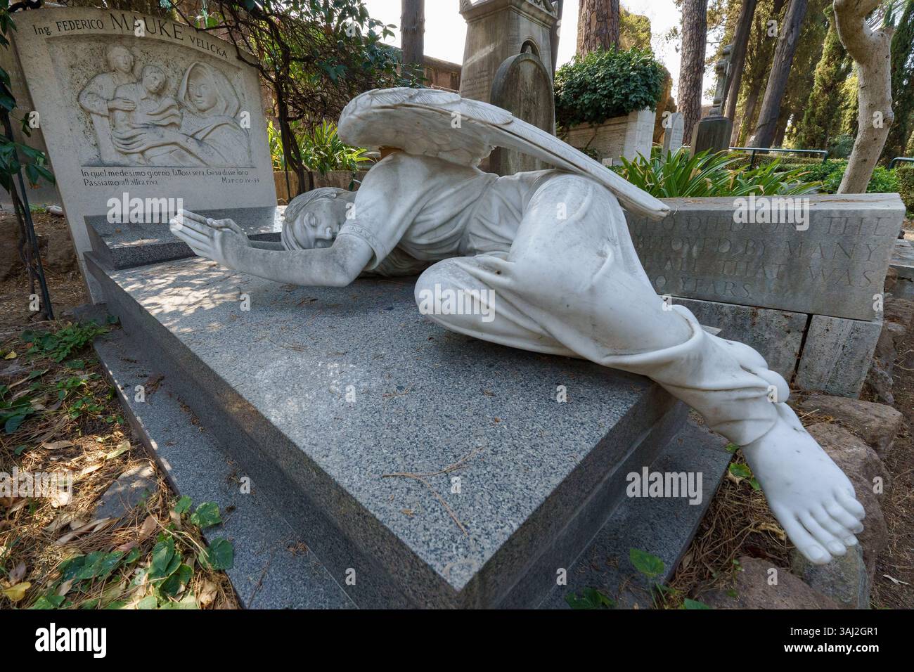 Praying Angel marble sculpture on a grave in the protestant cemetery in ...