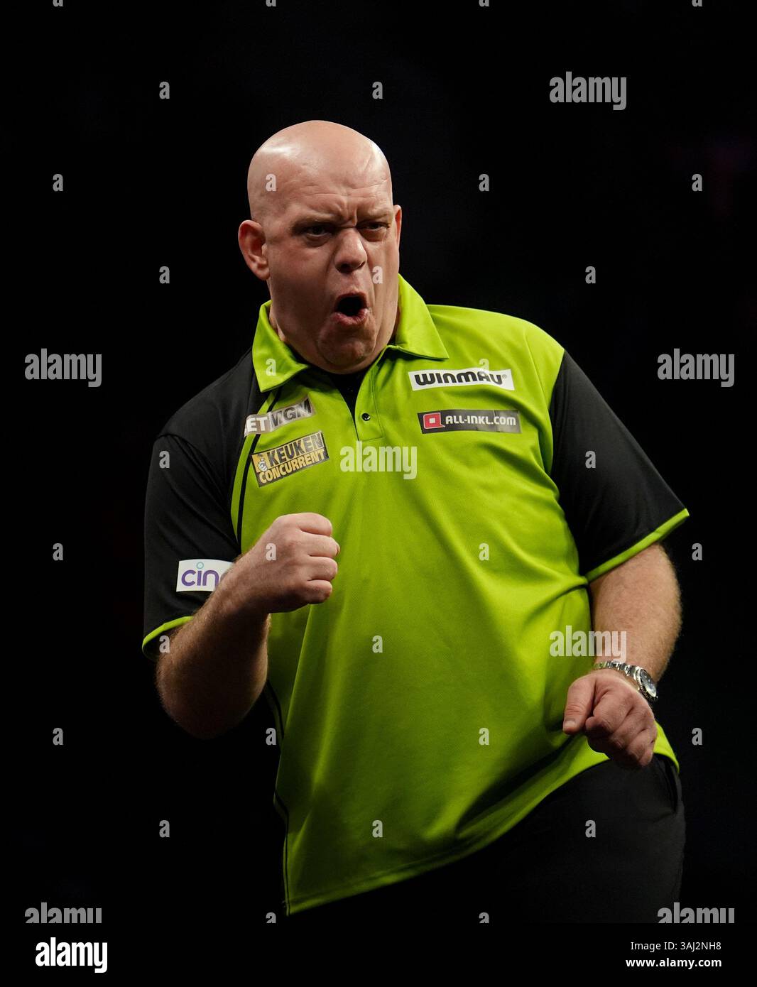 Michael van Gerwen celebrates winning a leg against Chris Dobey during ...
