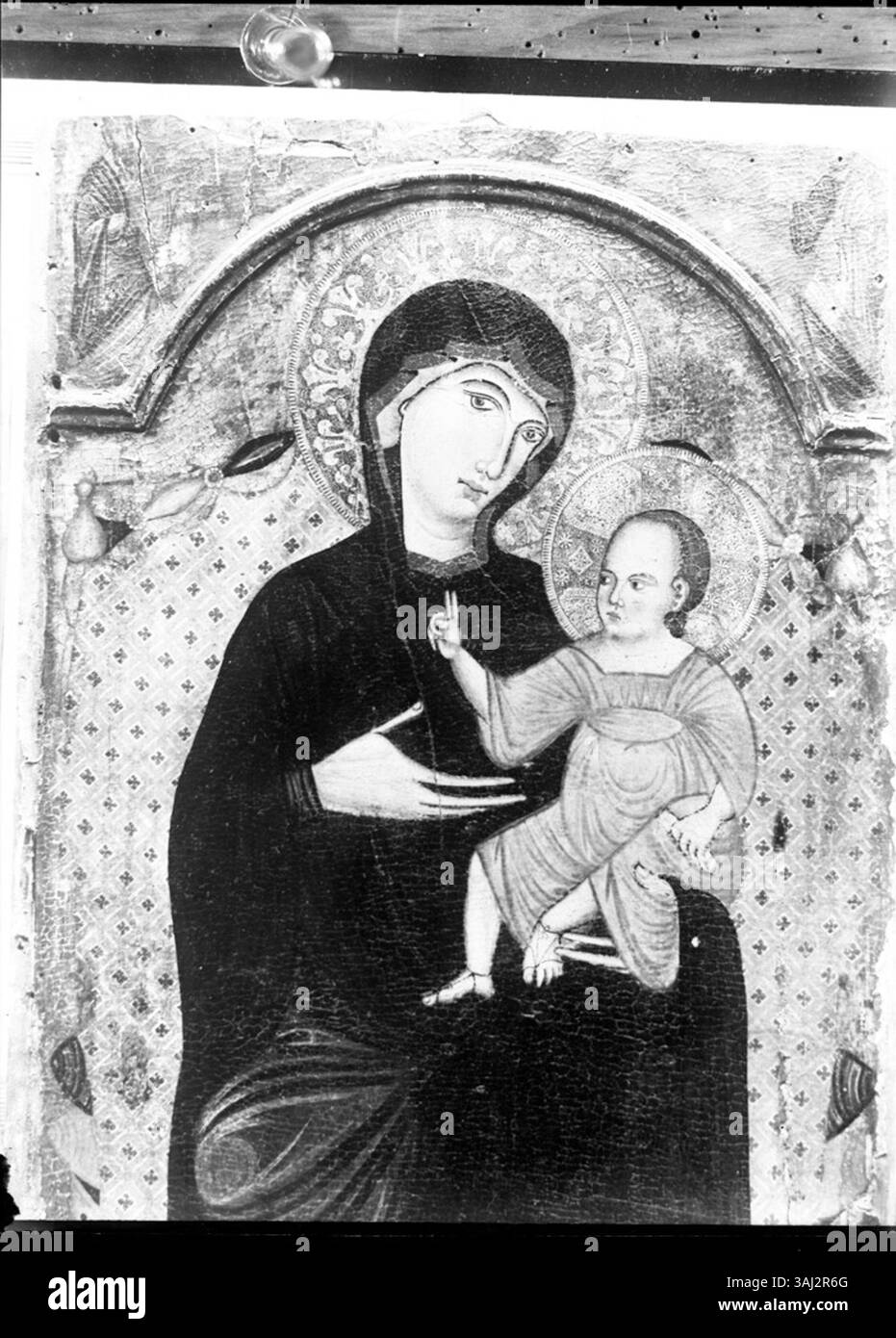 This 13th-century painting, attributed to an unknown artist, depicts the Virgin and Child ...