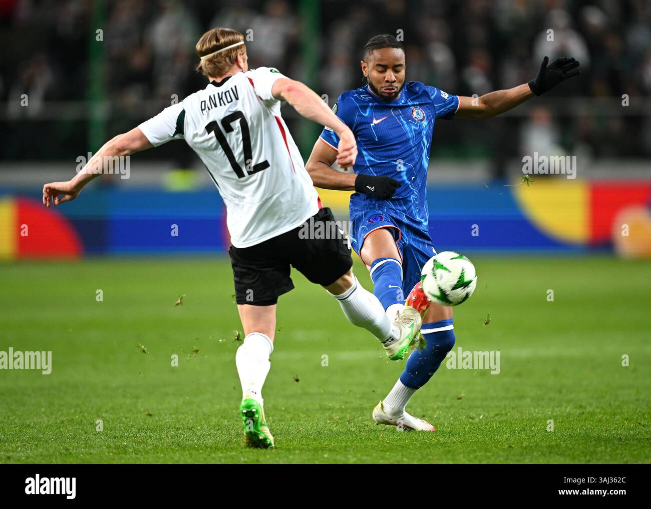 Legia Warsaw's Radovan Pankov (left) and Chelsea's Christopher Nkunku battle for the ball during ...