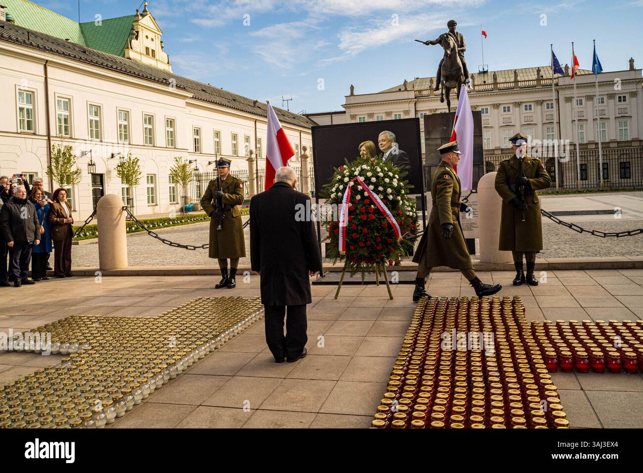 Jaroslaw Kaczynski pays his respects in front of a portrait of former ...