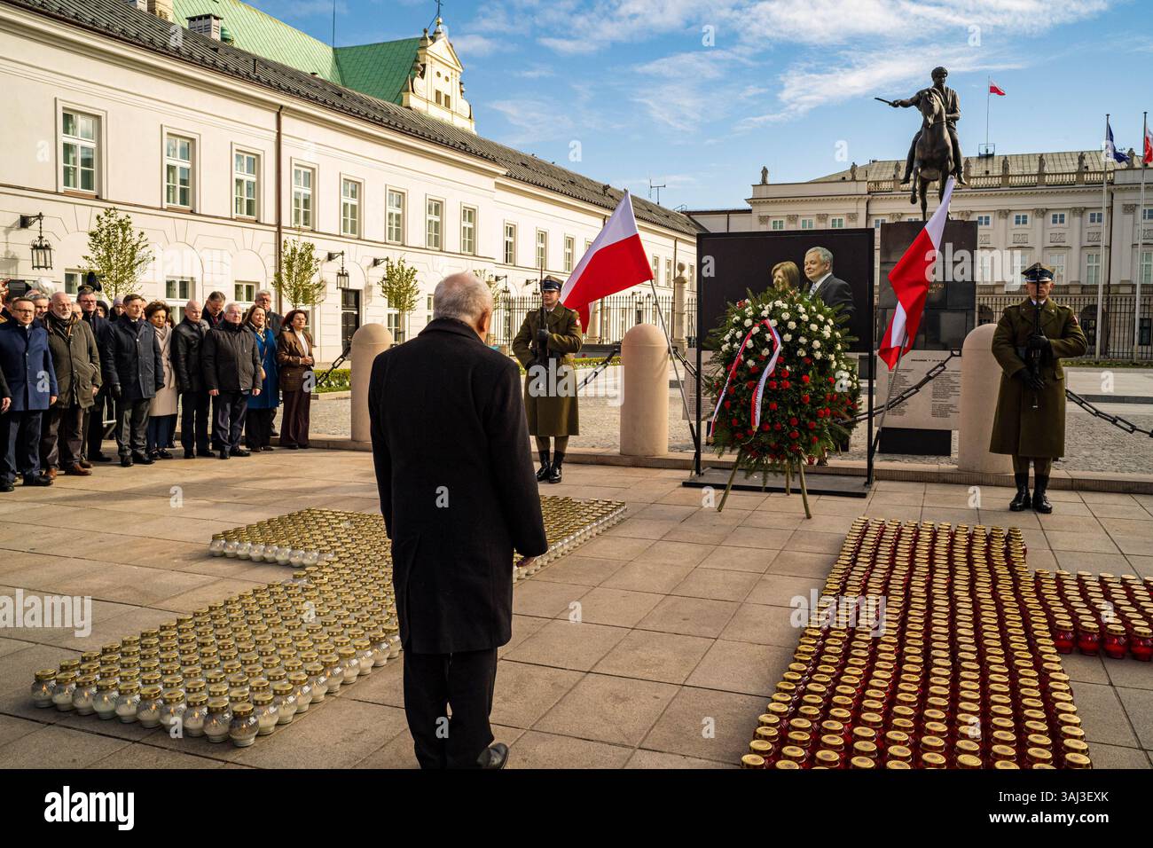 Jaroslaw Kaczynski pays his respects in front of a portrait of former ...