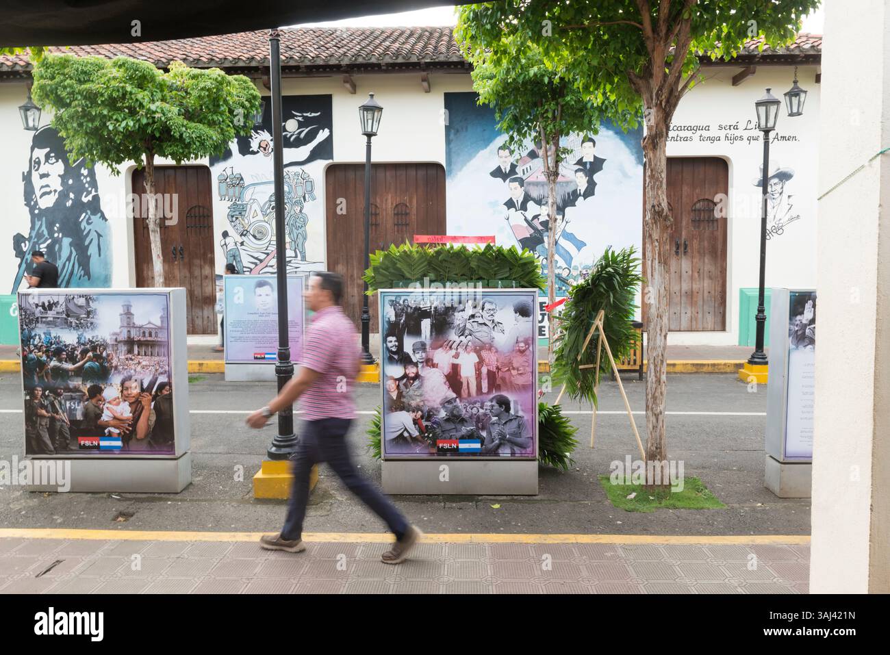 Man walks aong memorials of martyrs of the FSLN revolution in Leon ...