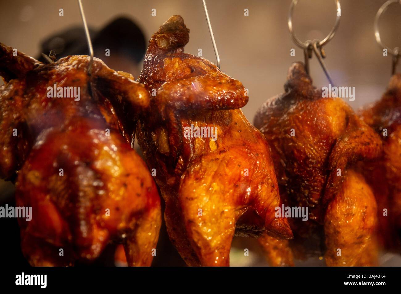 Hanging Roasted Chicken for nasi ayam Stock Photo - Alamy
