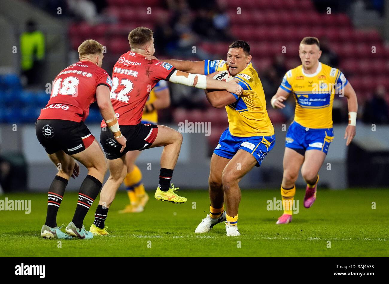 Salford Red Devils' Matty Foster and Leeds Rhinos' Ryan Hall during the ...