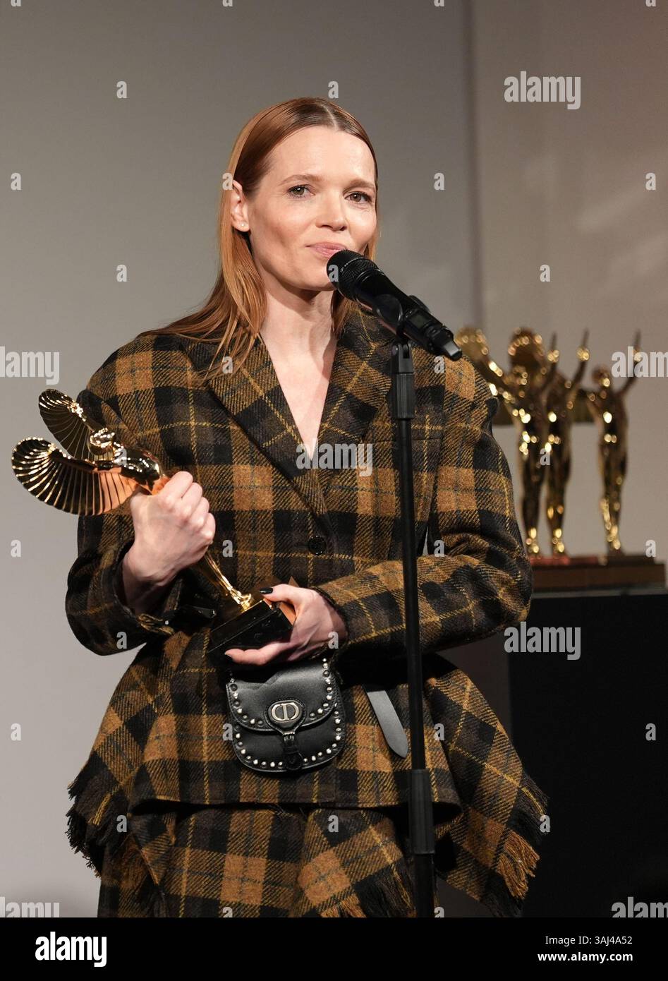 Hamburg, Germany. 10th Apr, 2025. Karoline Herfurth, actress, holds up ...